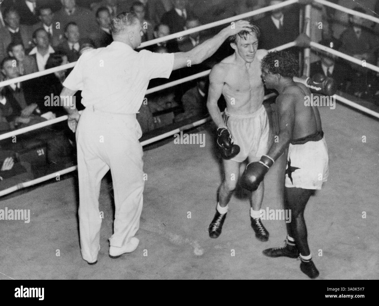 Elley Bennett gasps out congratulations as referee Bill Henneberry ...