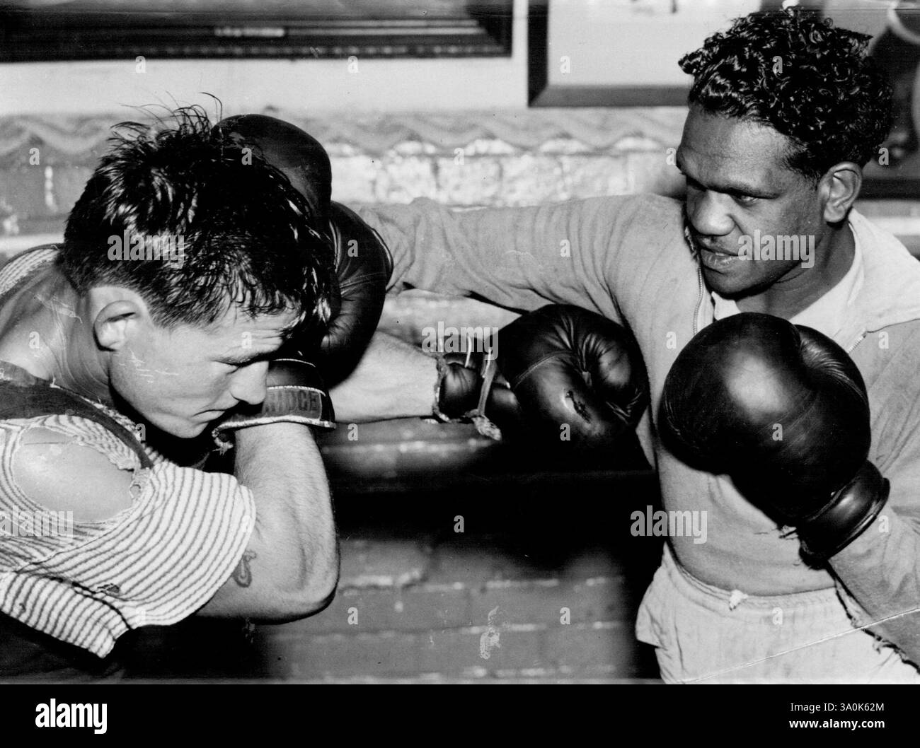 Featherweight champion Elley Bennett leads a right at the head of ...