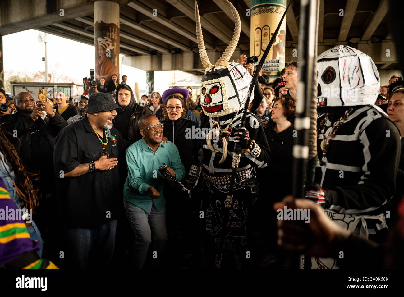 New Orleans, United States. 04th Mar, 2025. Bystanders dance alongside ...