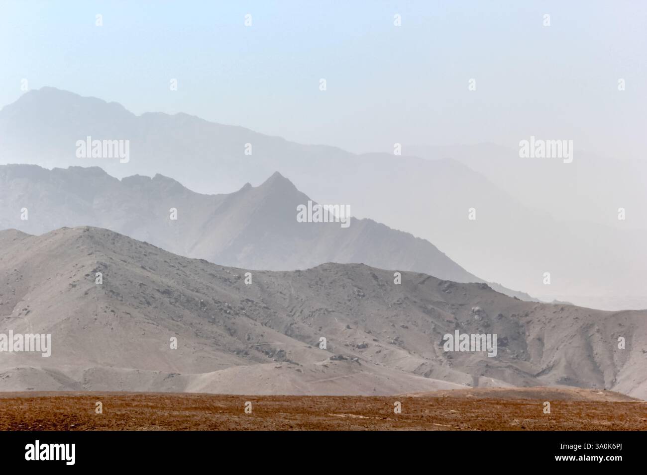 Beautiful layered mountain ranges in a serene desert setting ...