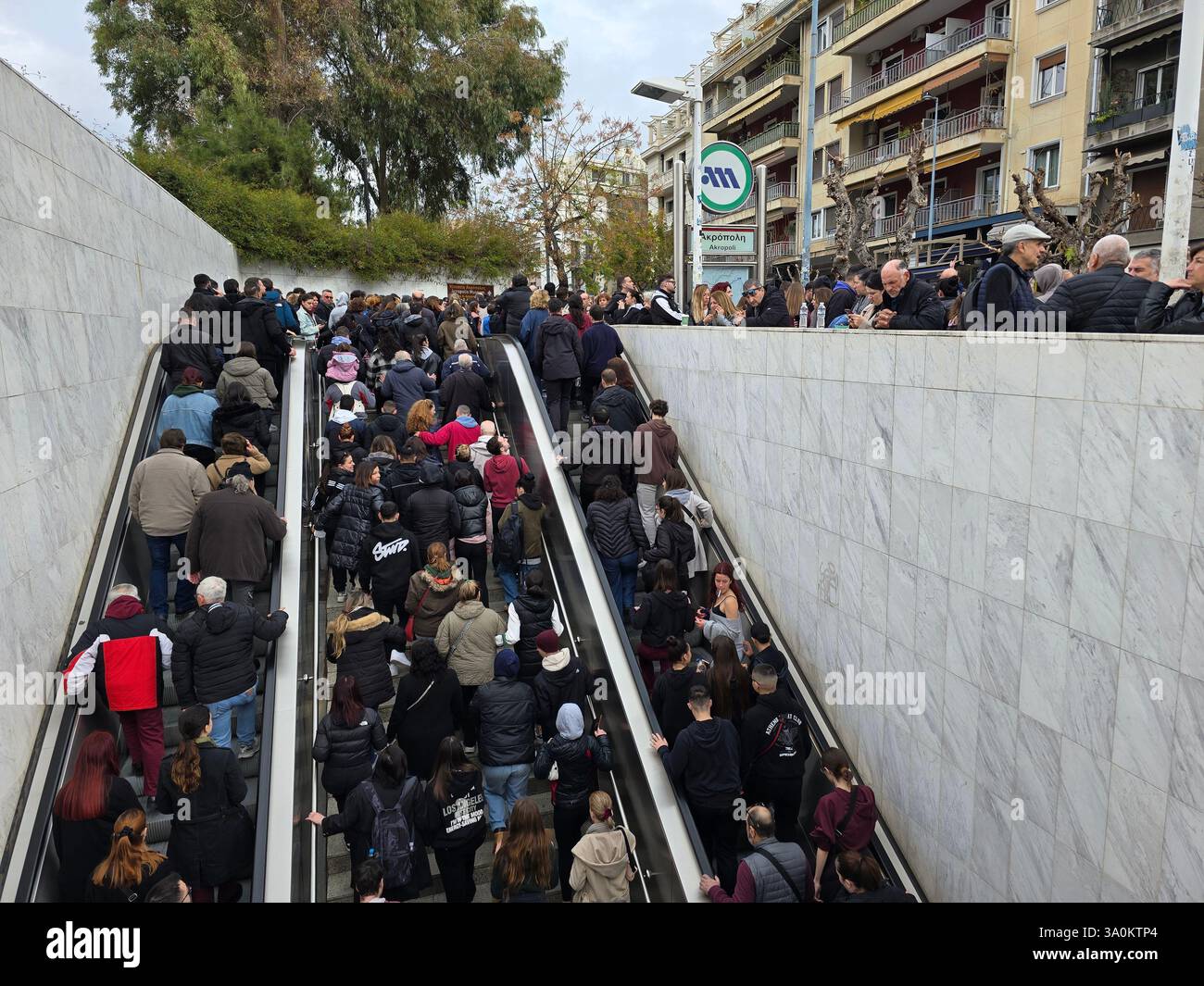 Athens, February 28, 2025: A large crowd of people using the escalators ...