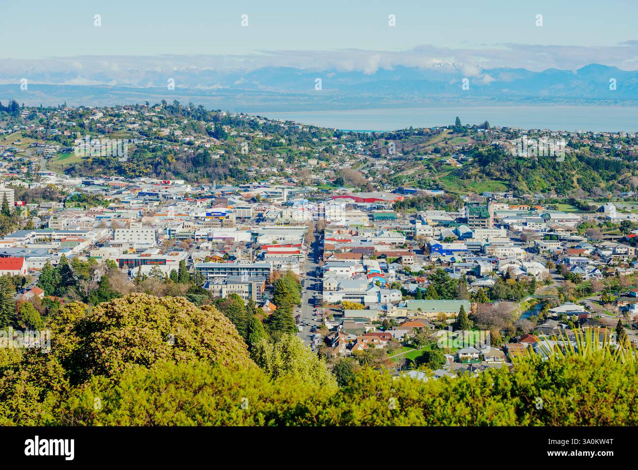 View of Nelson town and Mount Arthur mountain range in the distance ...