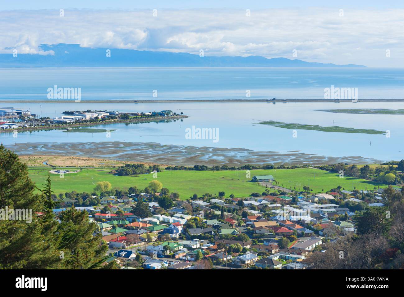 View of Nelson town and Mount Arthur mountain range in the distance ...