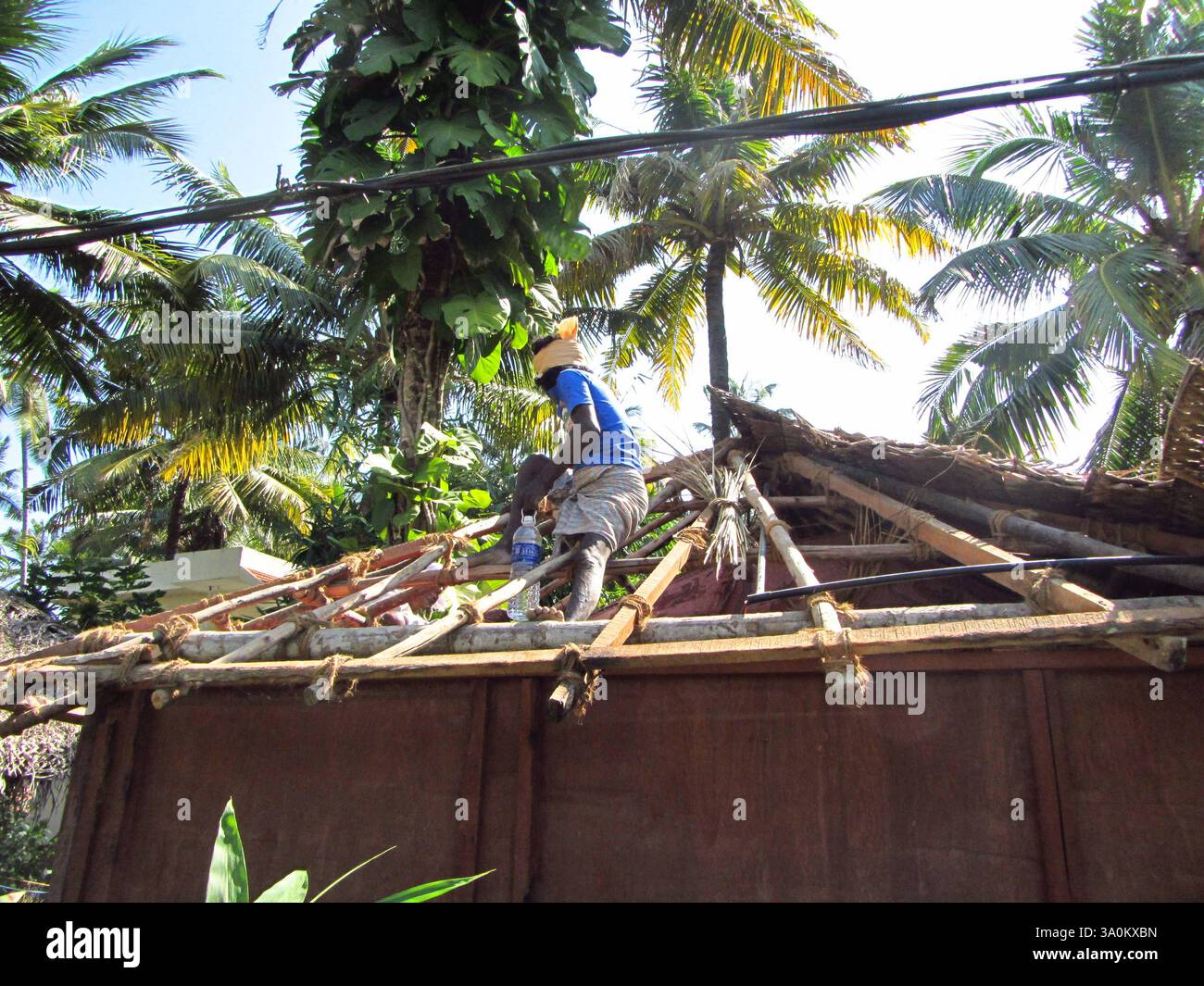 construction worker at topping out or roofing ceremony, when finishing ...