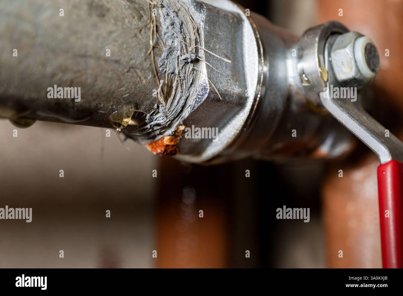 Corroded metal pipe with rust and valve close-up Stock Photo - Alamy