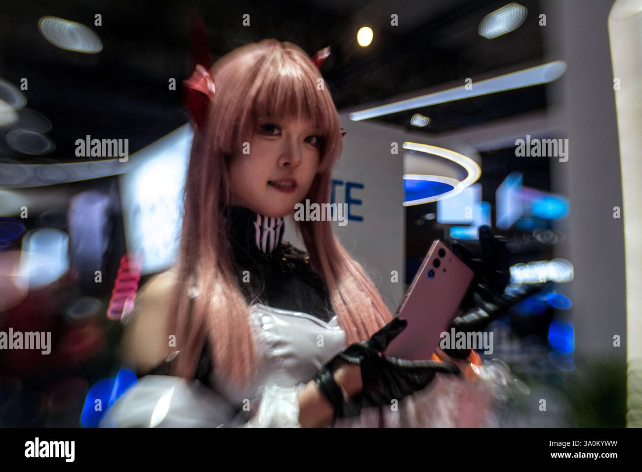 Barcelona, Spain. 4th Mar, 2025. A cosplay girl attends visitors at the ...