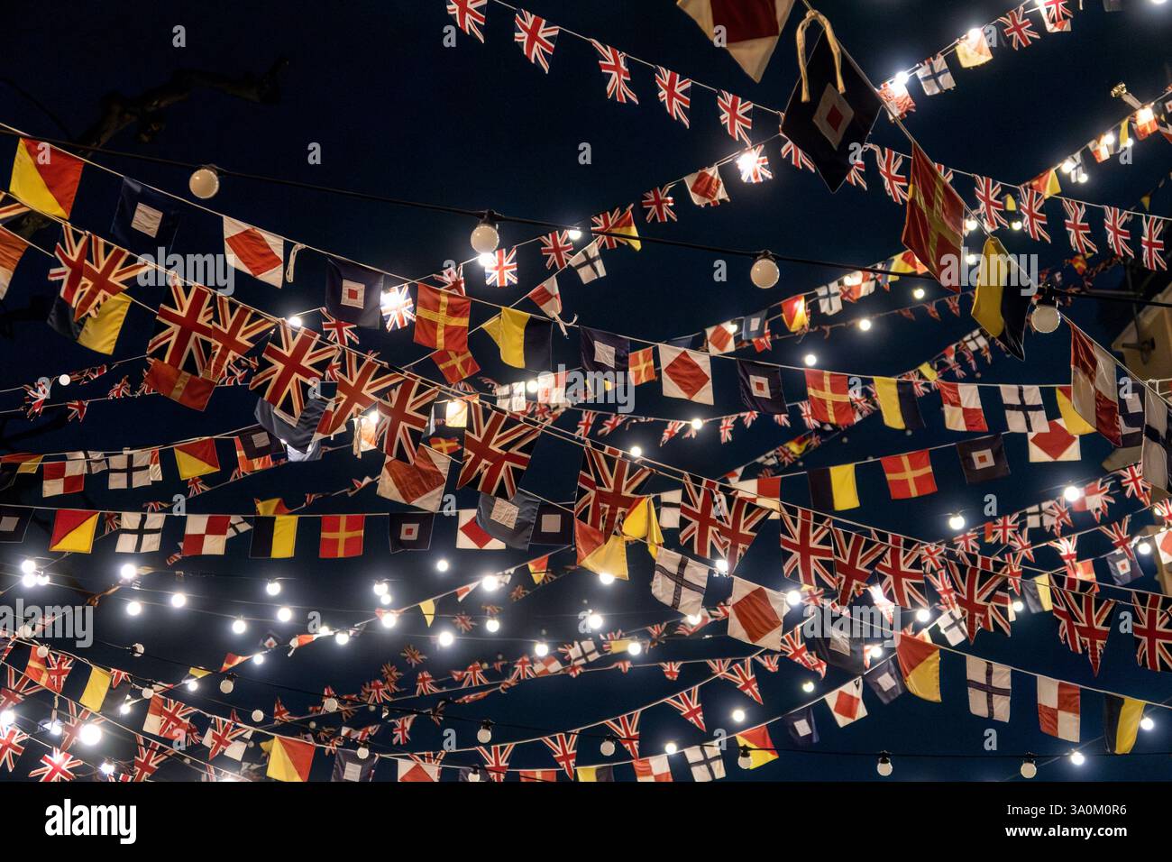 Festive Night Scene at The Trafalgar Tavern, Greenwich, with Union Jack ...
