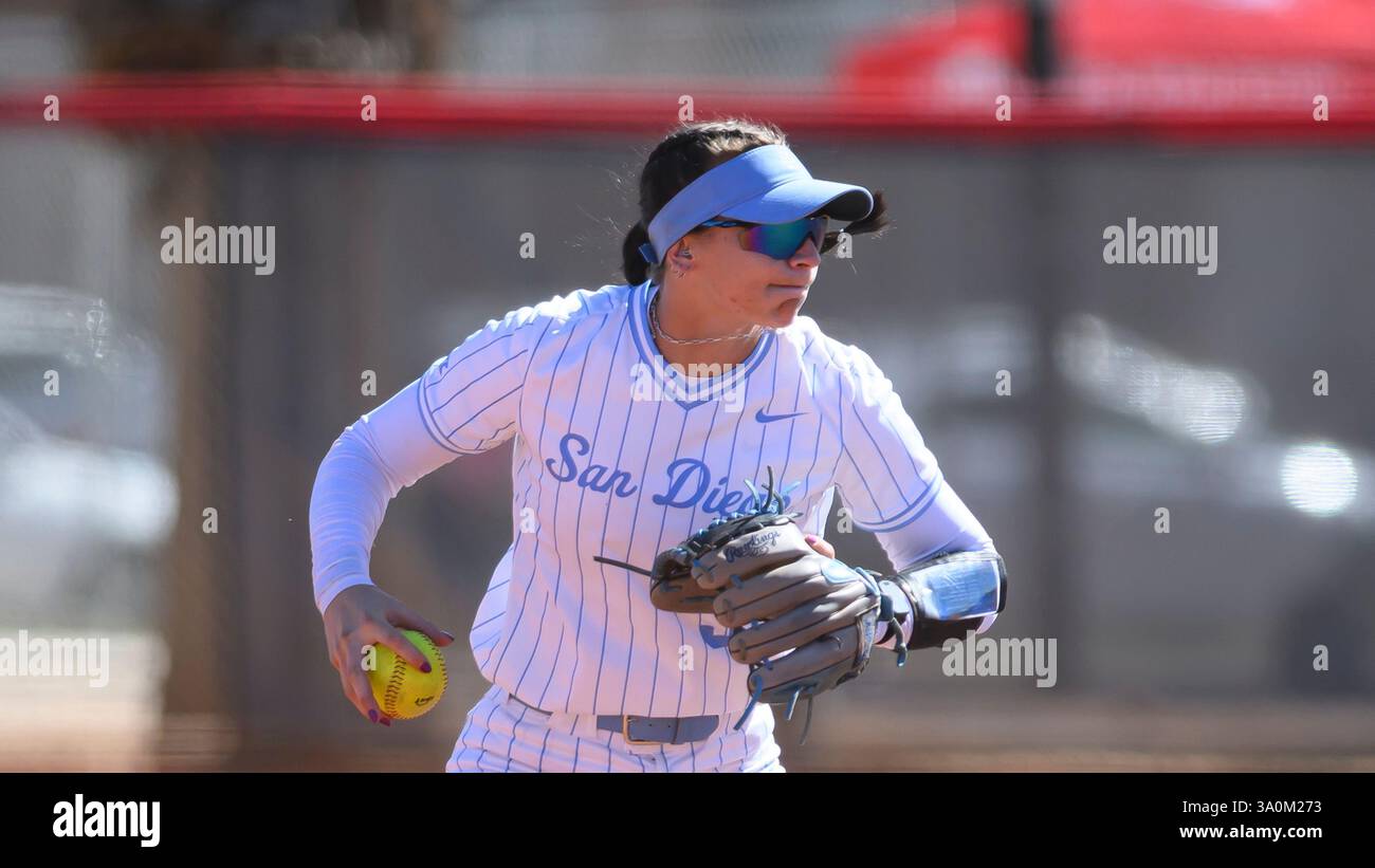 San Diego infielder Hailey Mulligan throws the ball to first base ...