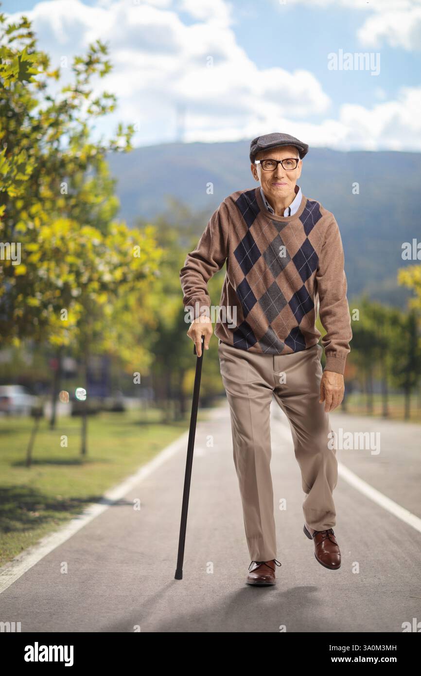 Old man walking bent hi-res stock photography and images - Alamy