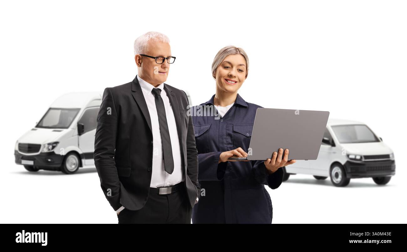 Female auto repair worker and a businessman with a laptop computer ...