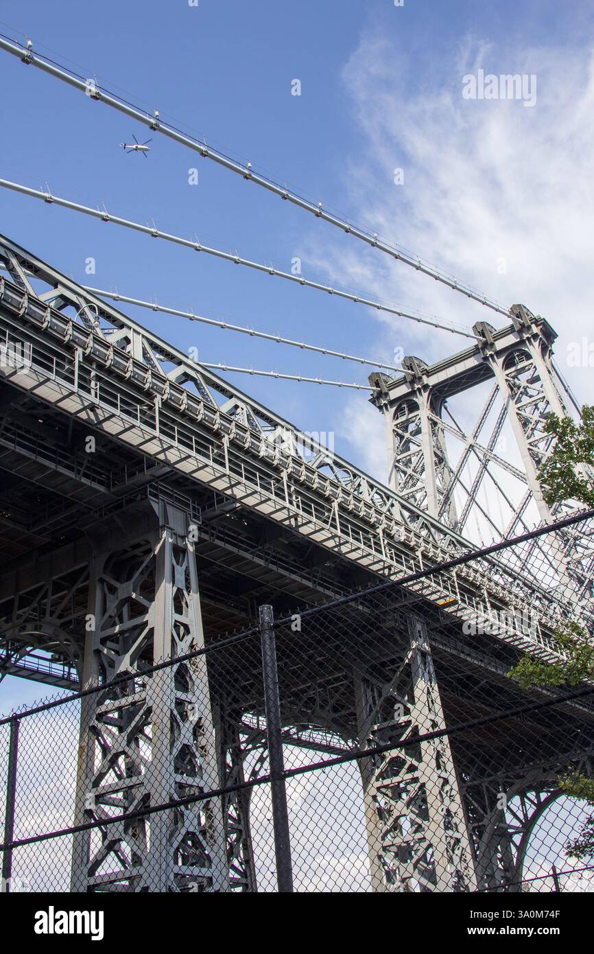 Looking up at Williamsburg Bridge underpass historic and contemporary ...