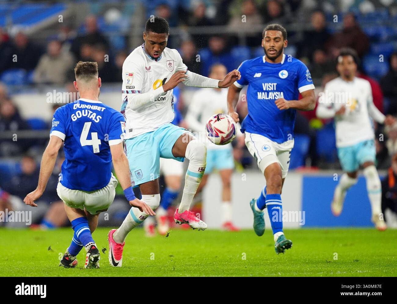 Cardiff City's Dimitris Goutas challenges Burnley's Jaidon Anthony ...