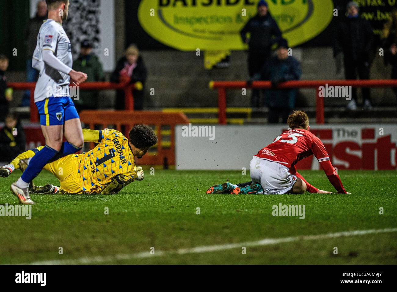 Owen Goodman of AFC Wimbledon brings down Morecambe FC's Ged Garner ...