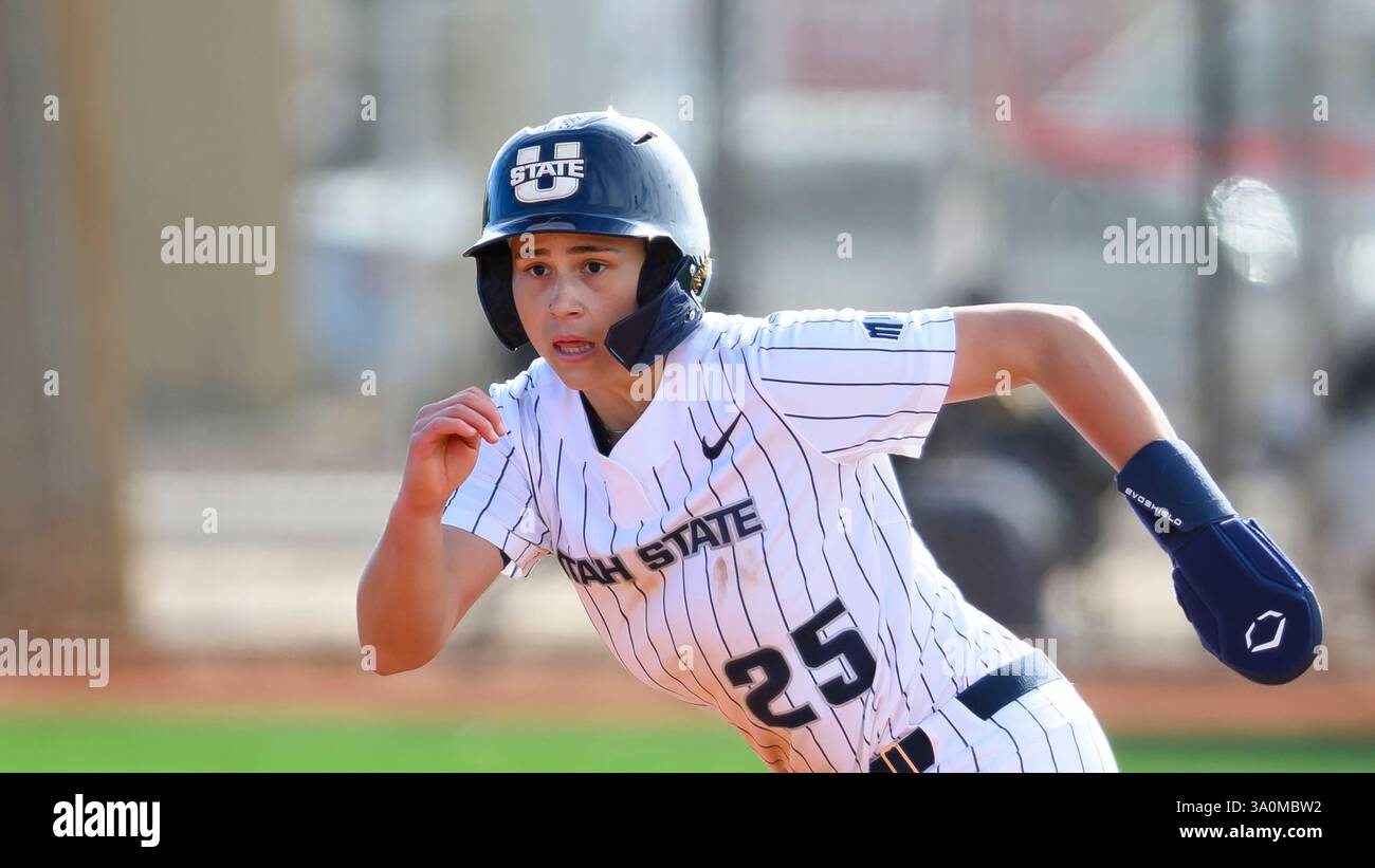 Utah State infielder Alex Bunton runs to third base during an NCAA ...