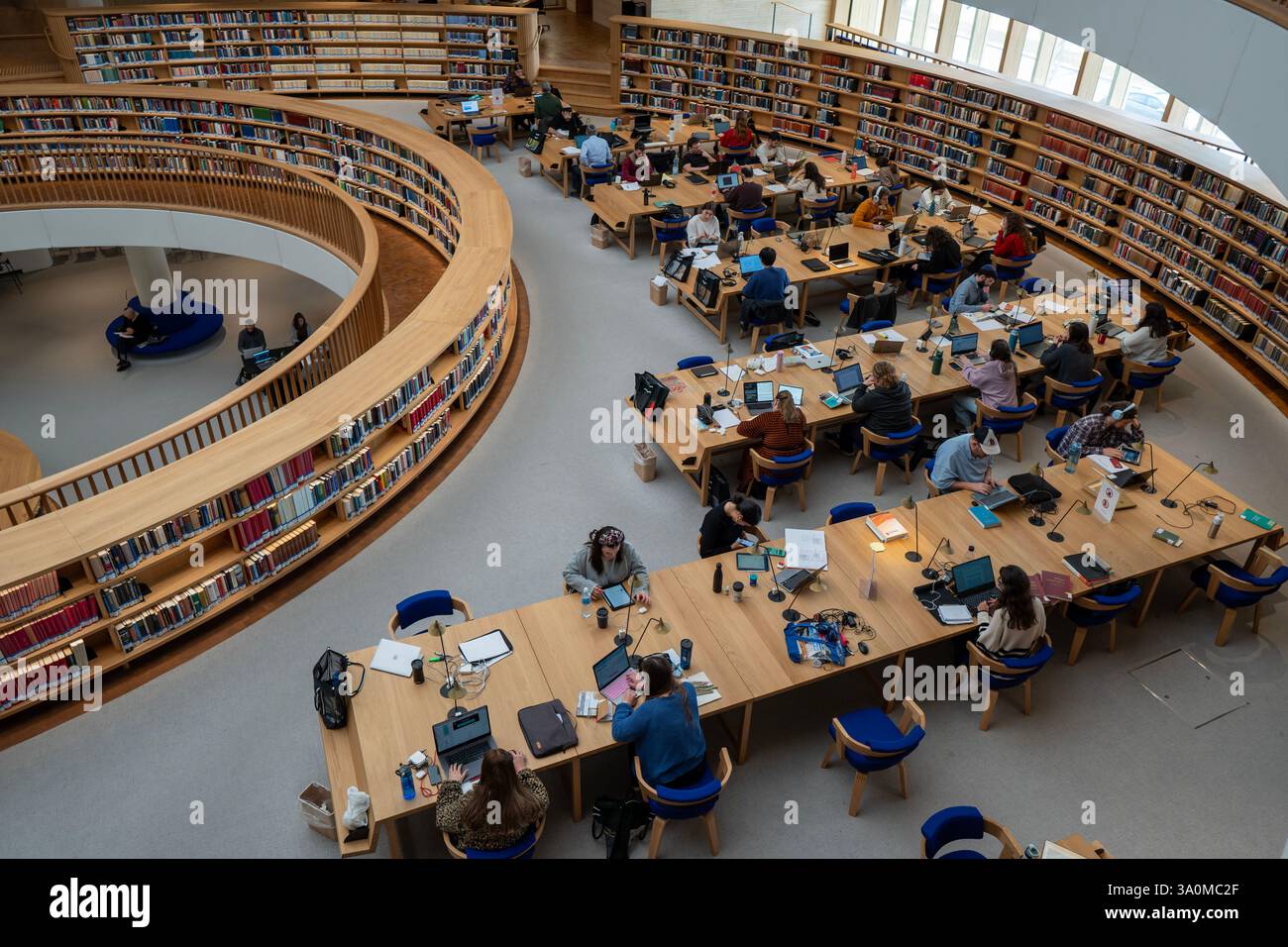 People study and read books at the reading hall of the new building of ...