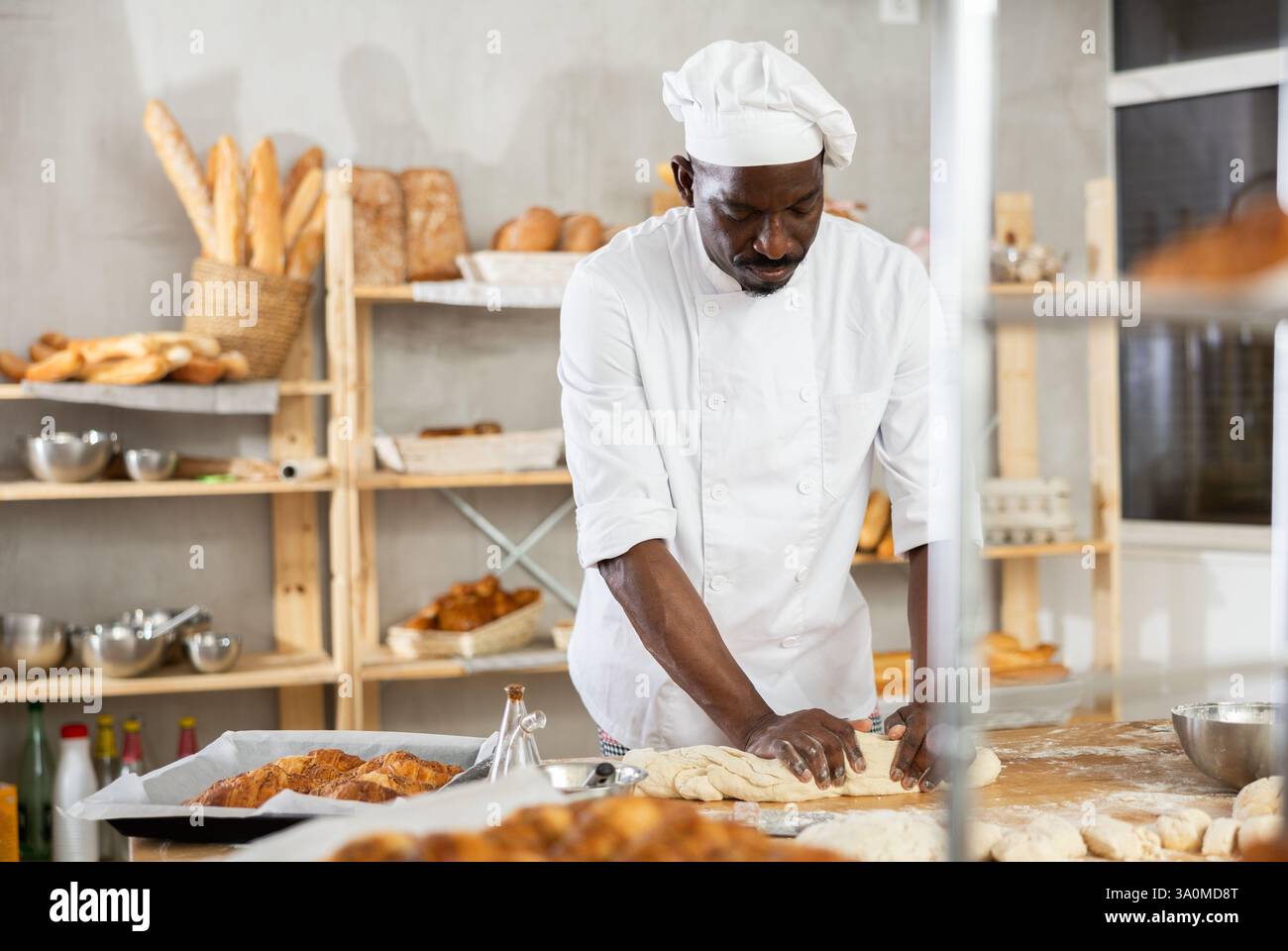 African american baker kneading hi-res stock photography and images - Alamy