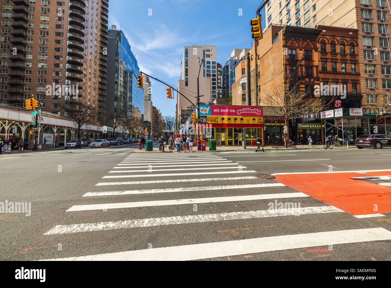 Busy street intersection in New York City with crosswalk, traffic ...