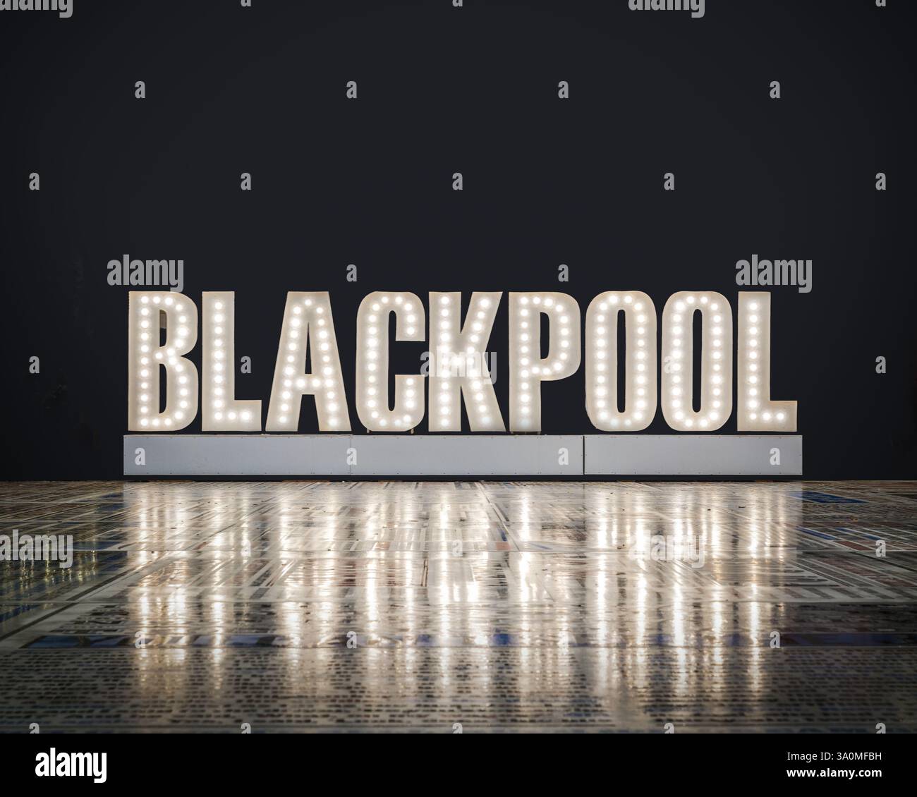 UK, Blackpool - Nov 2023: illuminated 'Blackpool' sign casts a vibrant ...