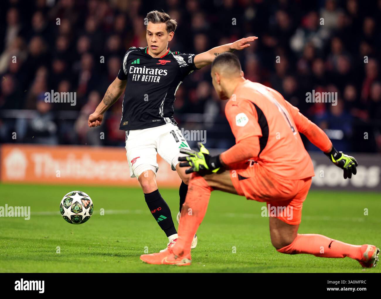 Arsenal's Leandro Trossard goes round PSV Eindhoven goalkeeper Walter ...