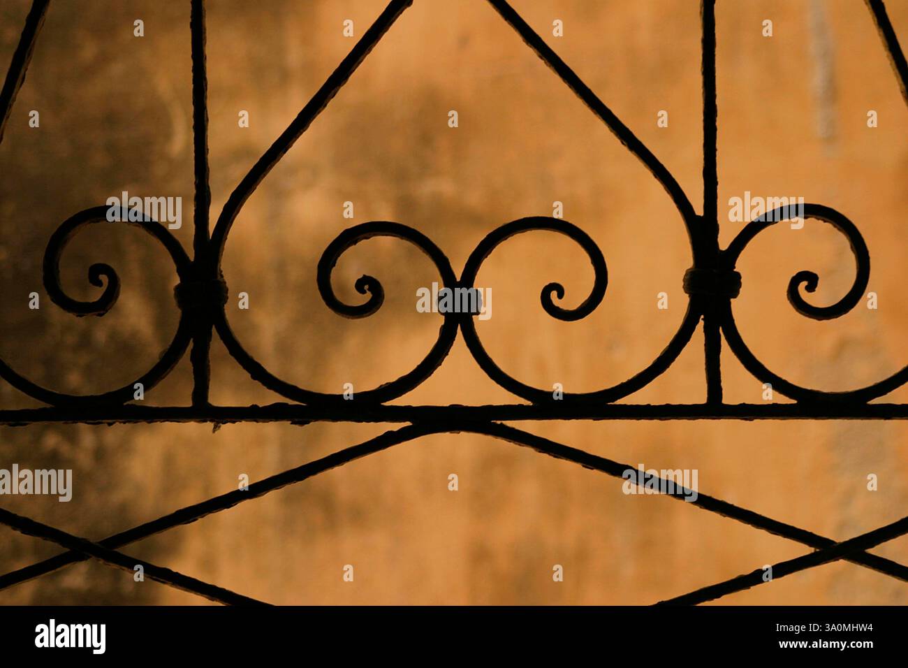 Decorative iron window fence at blue background Stock Photo - Alamy