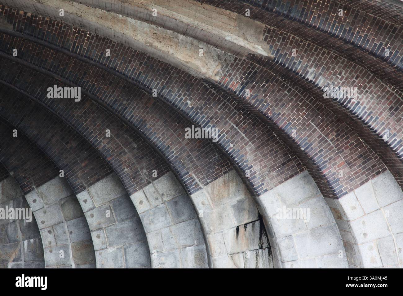 Curved brick wall with cascades Stock Photo - Alamy