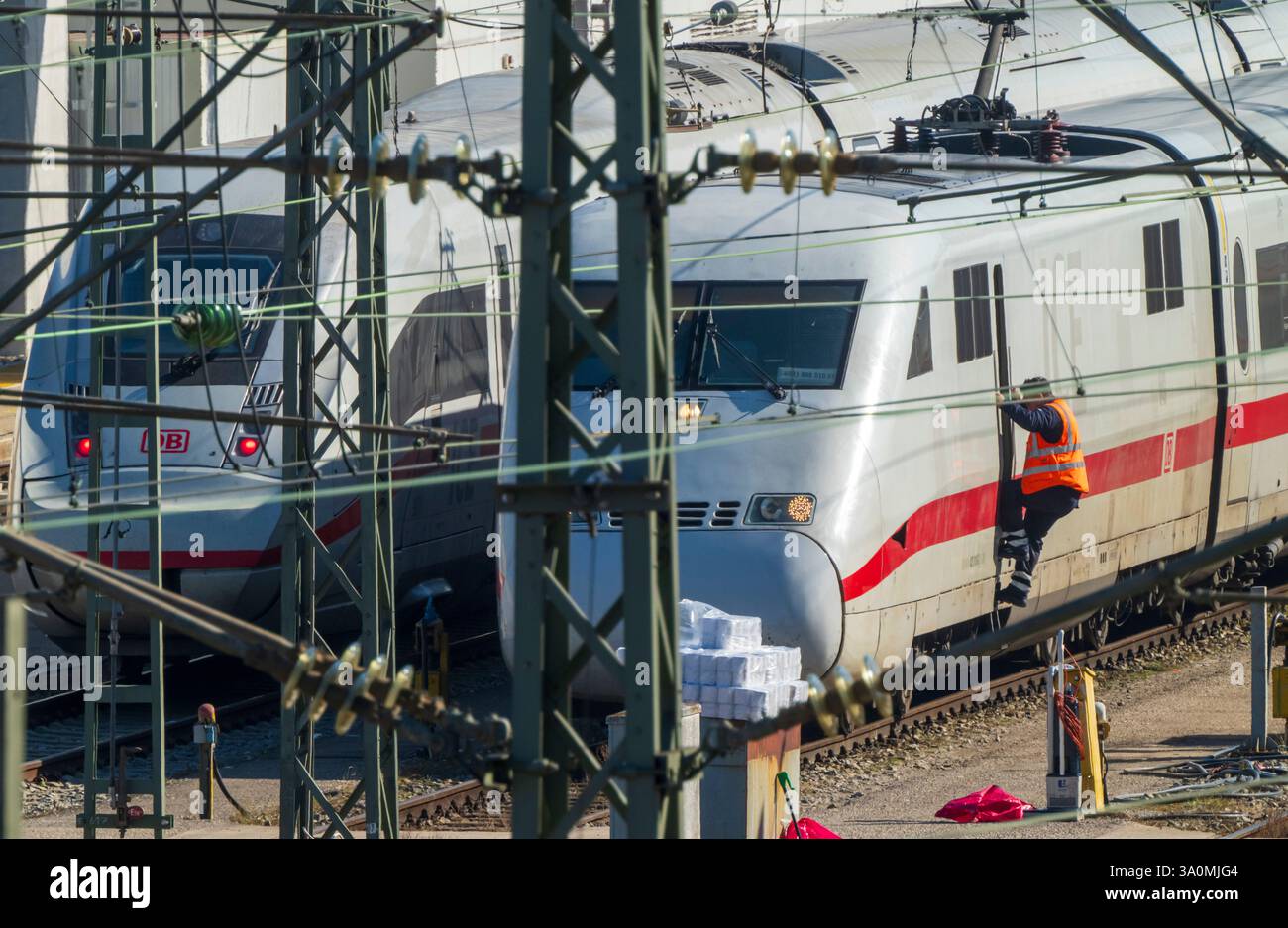 Munich, Germany. 04th Mar, 2025. A Deutsche Bahn employee boards an ICE ...