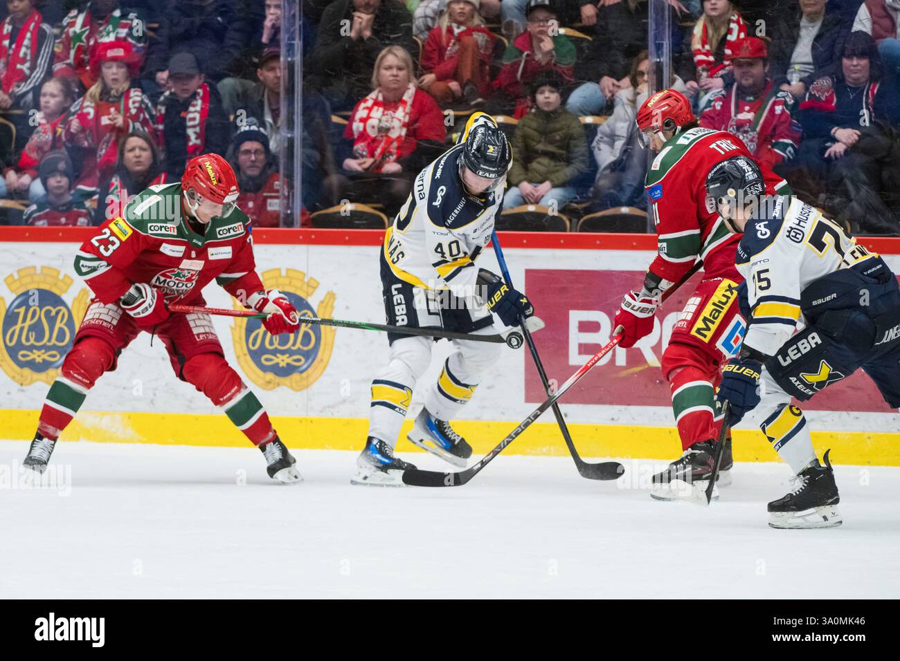 250304 Modos Tobias Winberg och Alexander True och HV71s Radan Lenc och Oskar Stål-Lyrenäs under ...