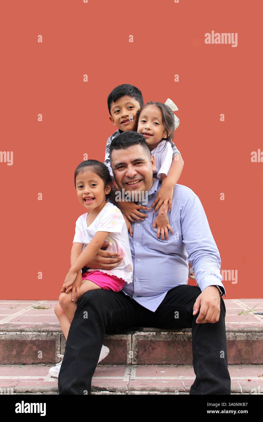 Latin family of a single dad with his 2 daughters and a son are happy ...