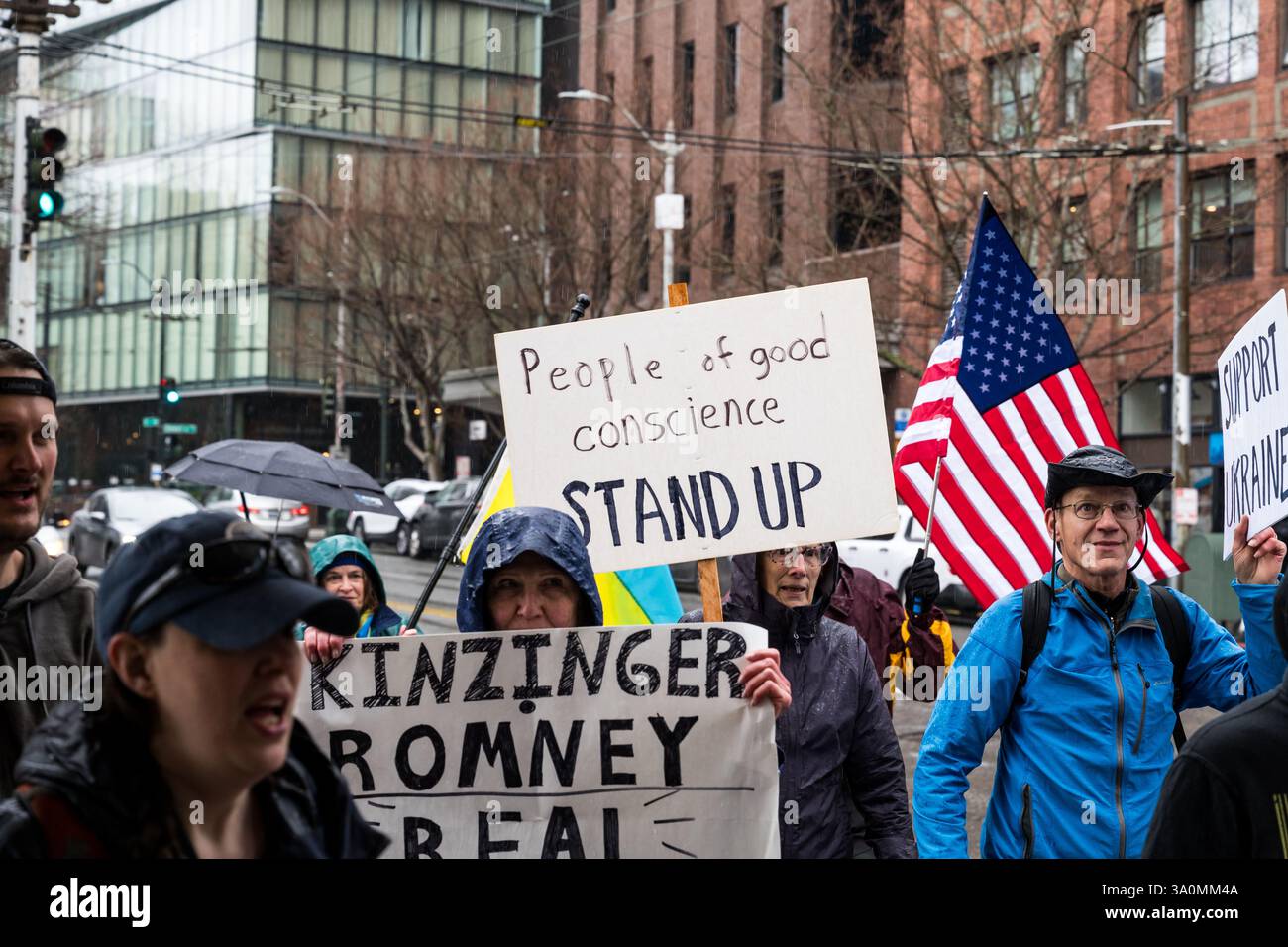 Seattle, USA. 4th Mar 2025. Activists march through Pike Place Market ...