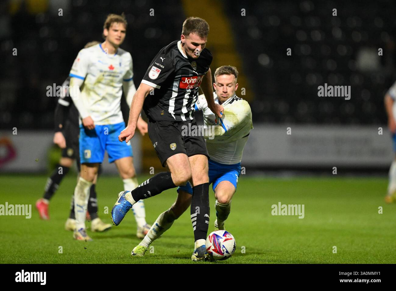 Elliot Newby of Barrow puts pressure on Matthew Platt of Notts County ...