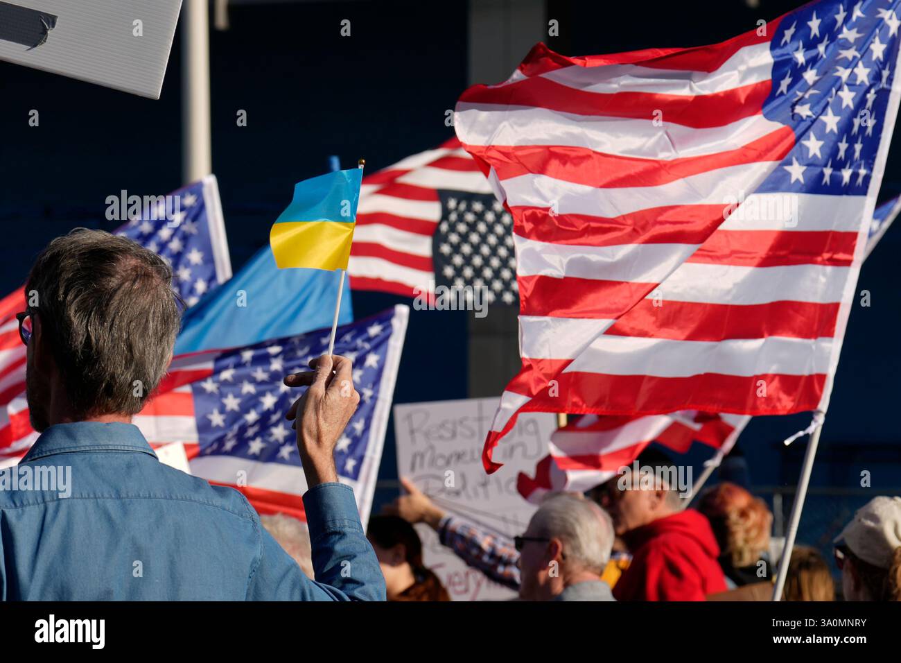 Flags fly in the wind during a protest against the Trump administration ...