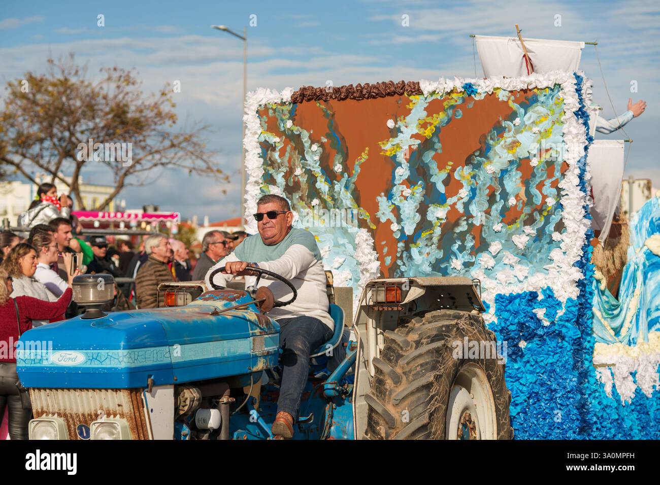 Altura, Portugal, March 2, 2025. Vibrant float pulled by a tractor ...