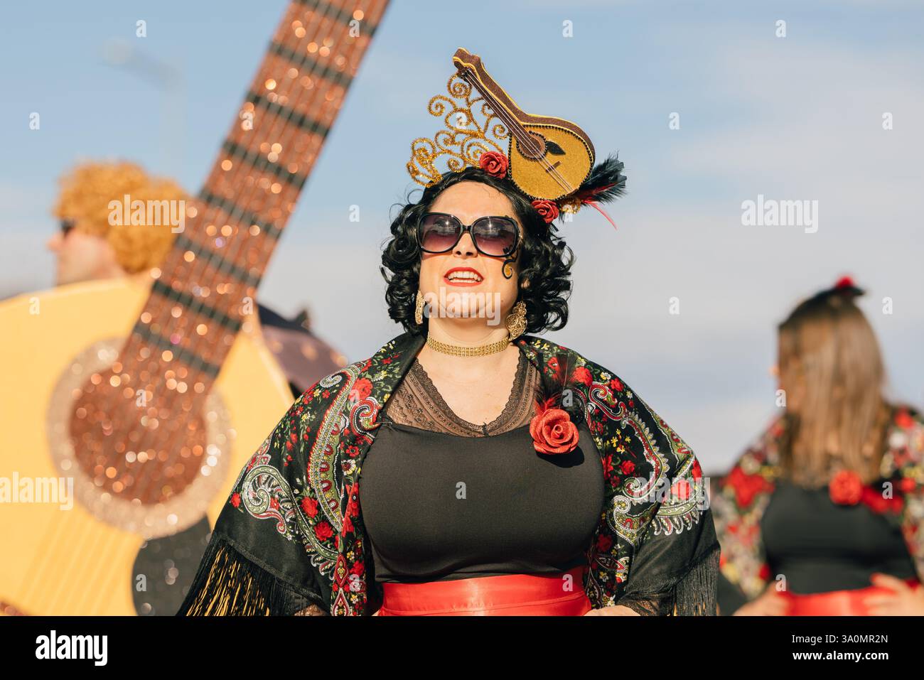 Altura, Portugal, March 2, 2025. A woman in an ornate black and red ...