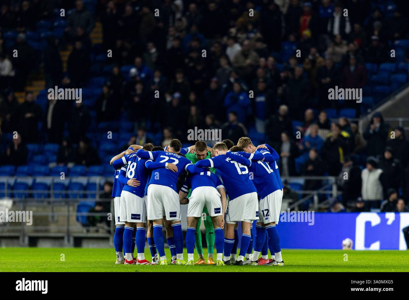 Cardiff, UK. 04th Mar, 2025. Cardiff City players in a huddle ahead of ...