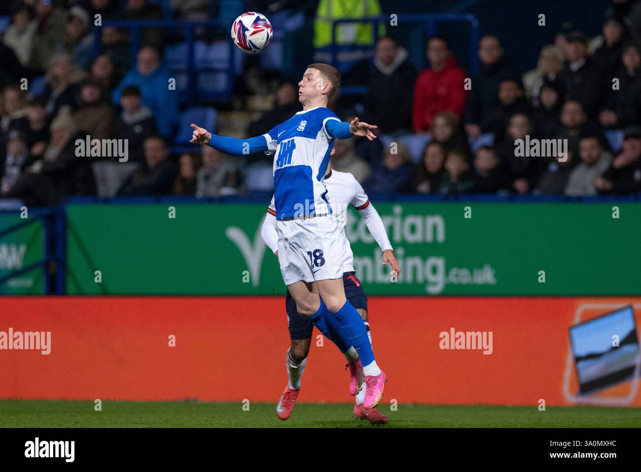 Jay Stansfield #28 of Birmingham City F.C.chests the ball during the ...