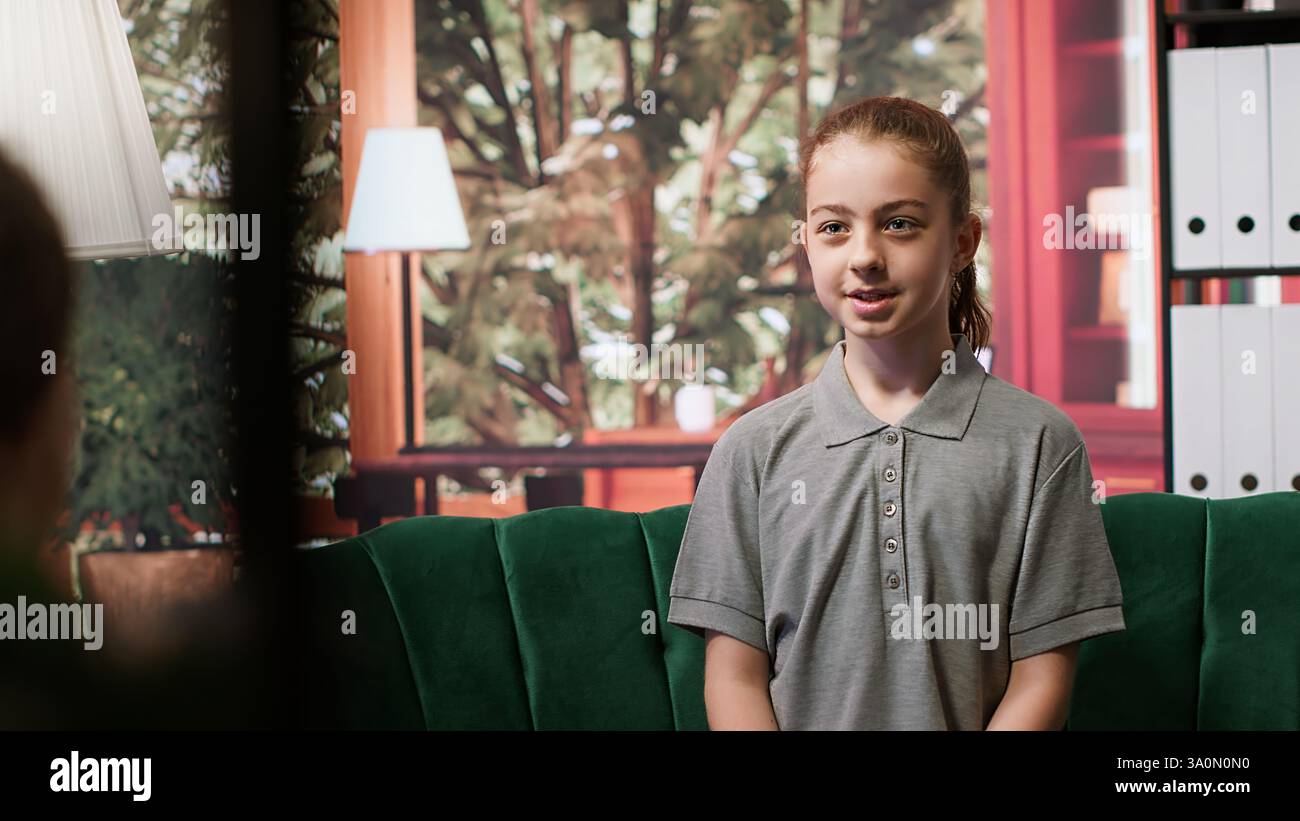 Teenager at therapy session struggling with emotional issues ...