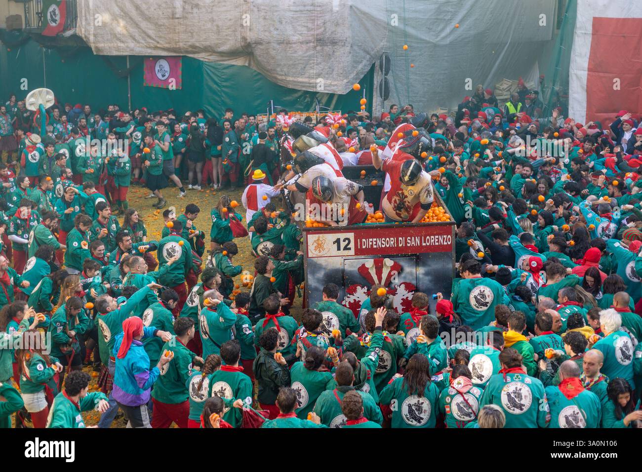 Members of the orange battle teams participate in the traditional ...