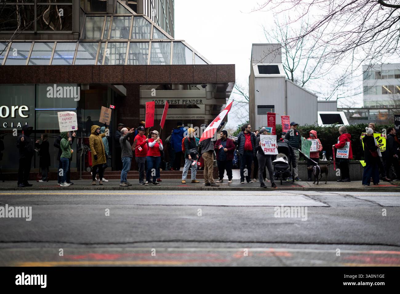 People wave flags and hold signs during a protest outside of the U.S ...