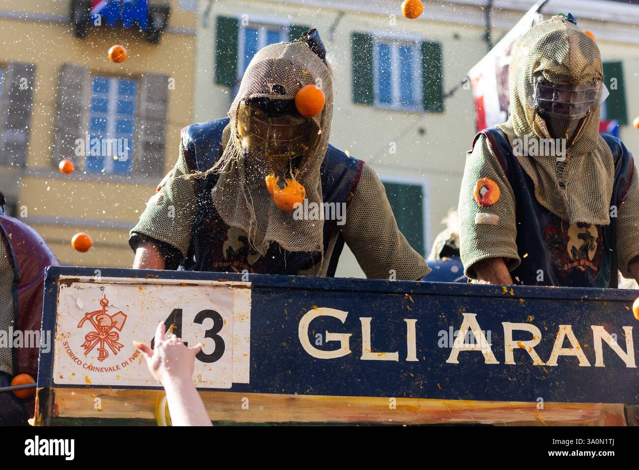 Members of the orange battle teams participate in the traditional ...