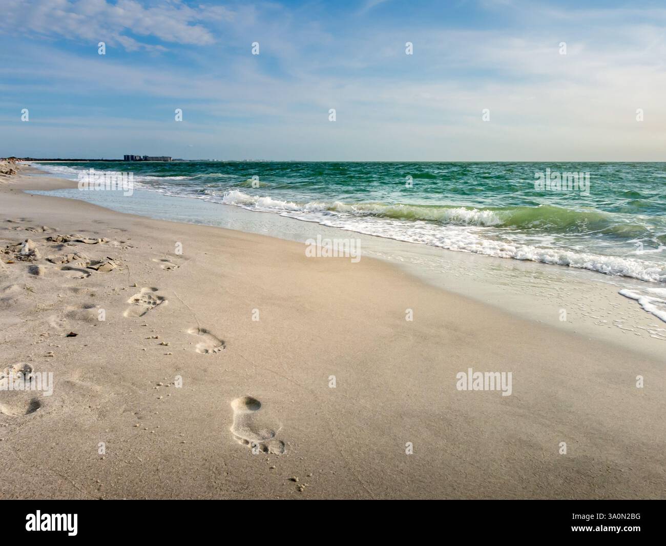 Footprints trace a path along the tranquil sands of Lovers Key State ...
