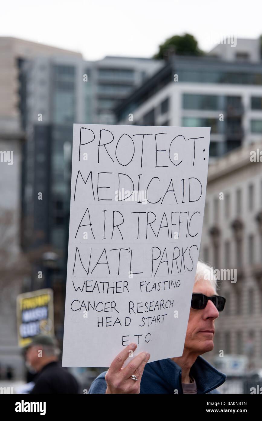 San Francisco, USA. 4th Mar 2025. A man holds a sign reading, "Protect ...