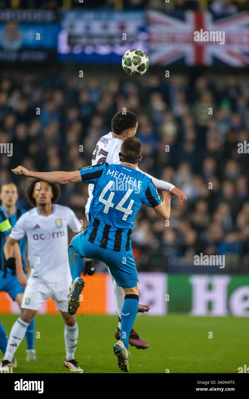 Brandon Mechele of Brugge jumps for the ball with Morgan Rogers of ...