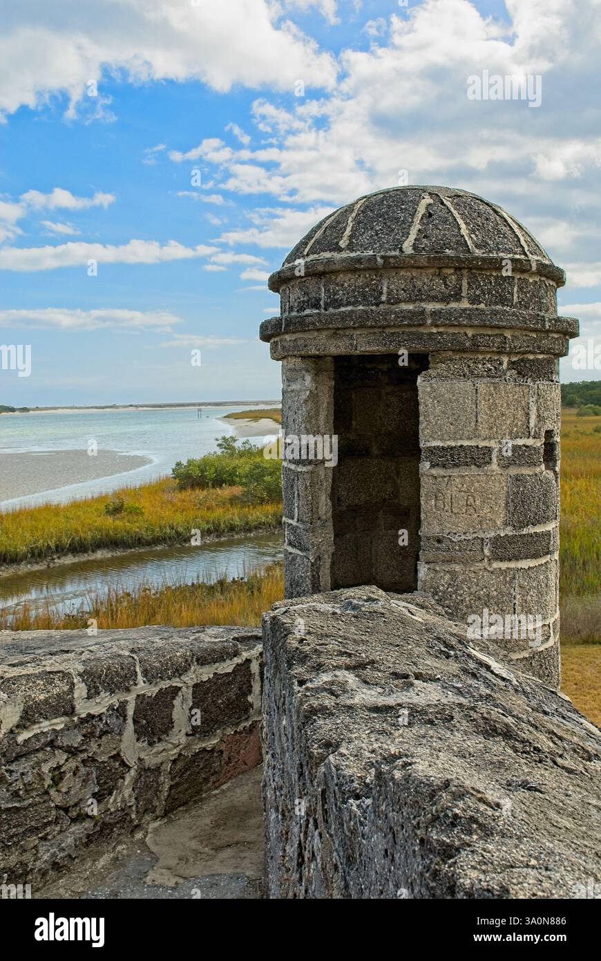 Fort Matanzas coquina masonry watchtower under bright cumulus clouds ...