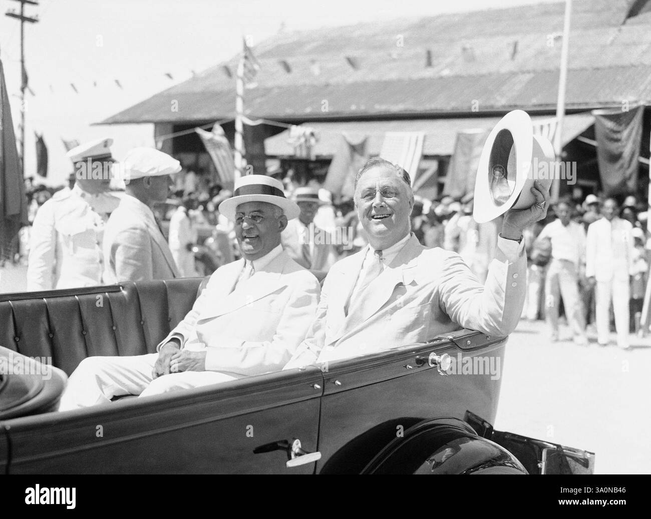 President Franklin D. Roosevelt lifts his hat in acknowledgement of the ...