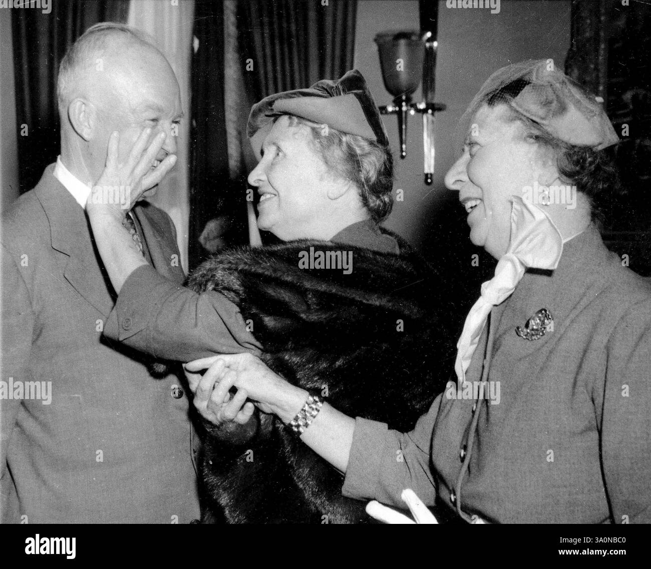 Helen Keller, 73, who is blind and deaf, guides her hand over President ...