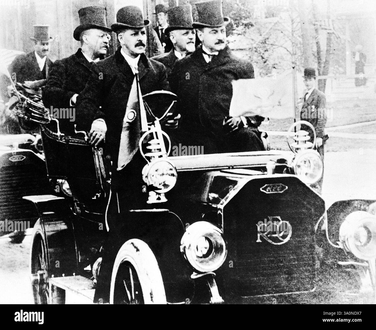 President Theodore Roosevelt, seated at left in rear, is shown during a ...