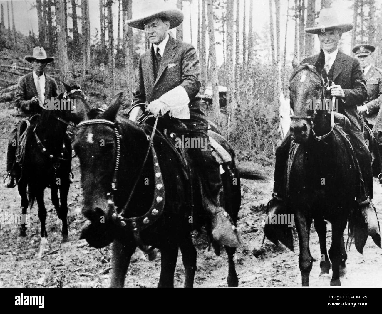 President Calvin Coolidge, center, rides on horseback to attend the ...
