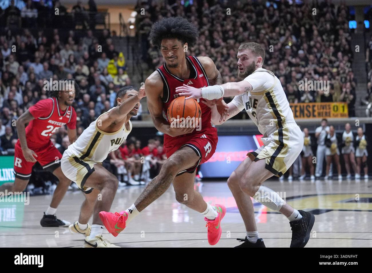 Rutgers guard Dylan Harper (2) drives past Purdue guard Braden Smith (3 ...