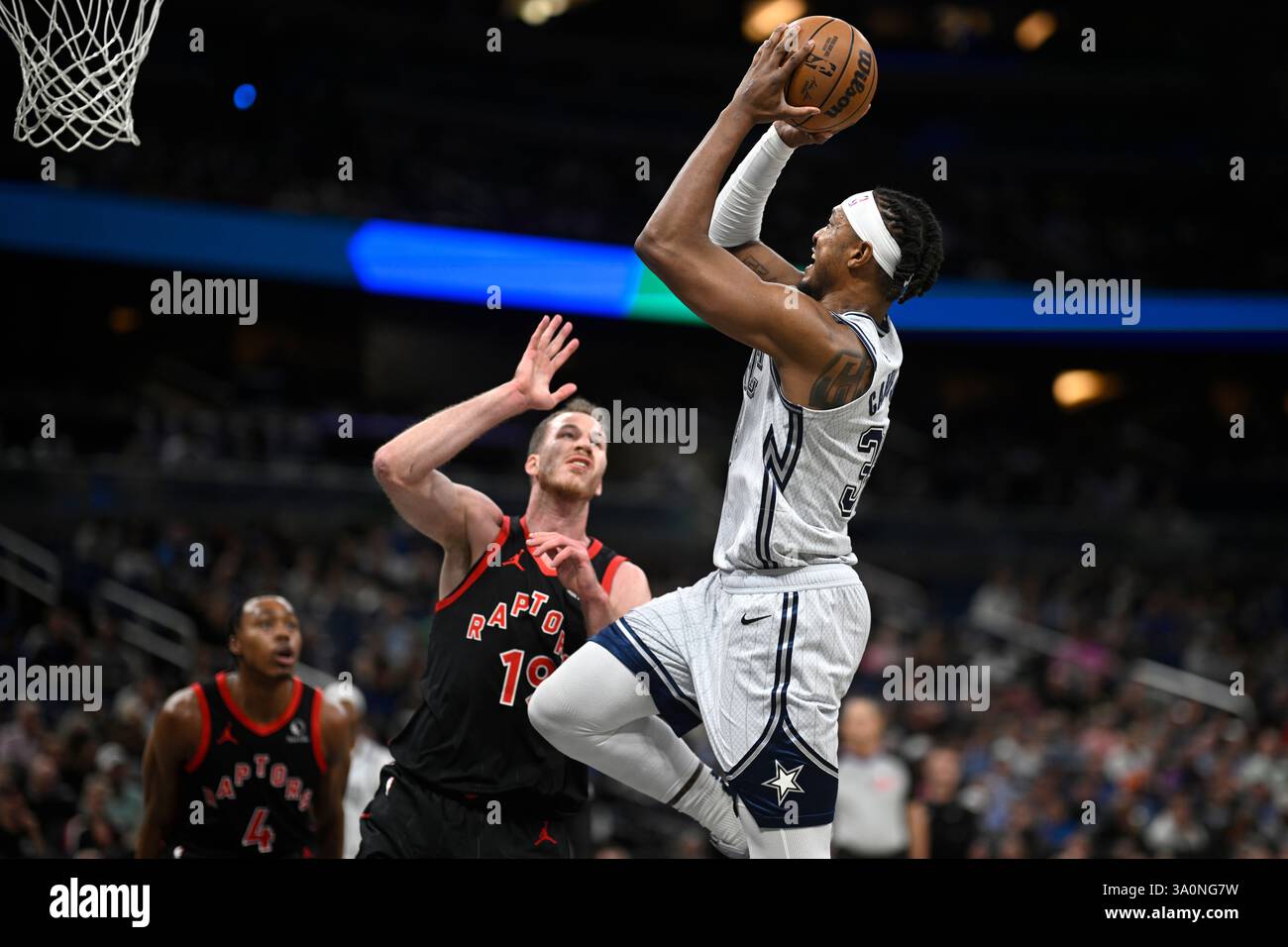 Orlando Magic center Wendell Carter Jr., right, goes up to shoot as ...