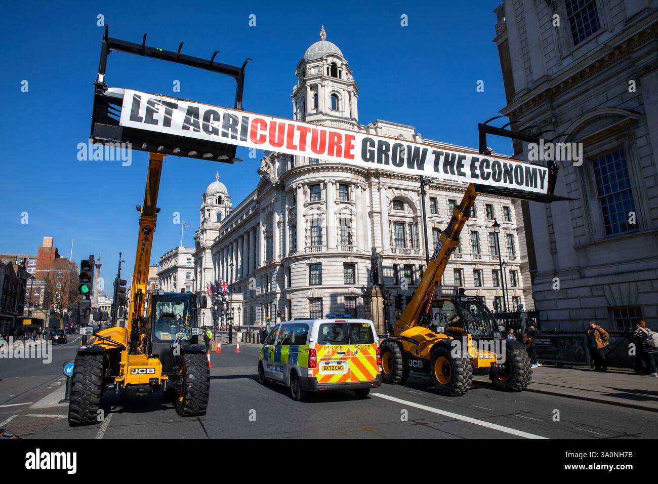 A banner is seen on farming machinery during the farmers demonstration ...